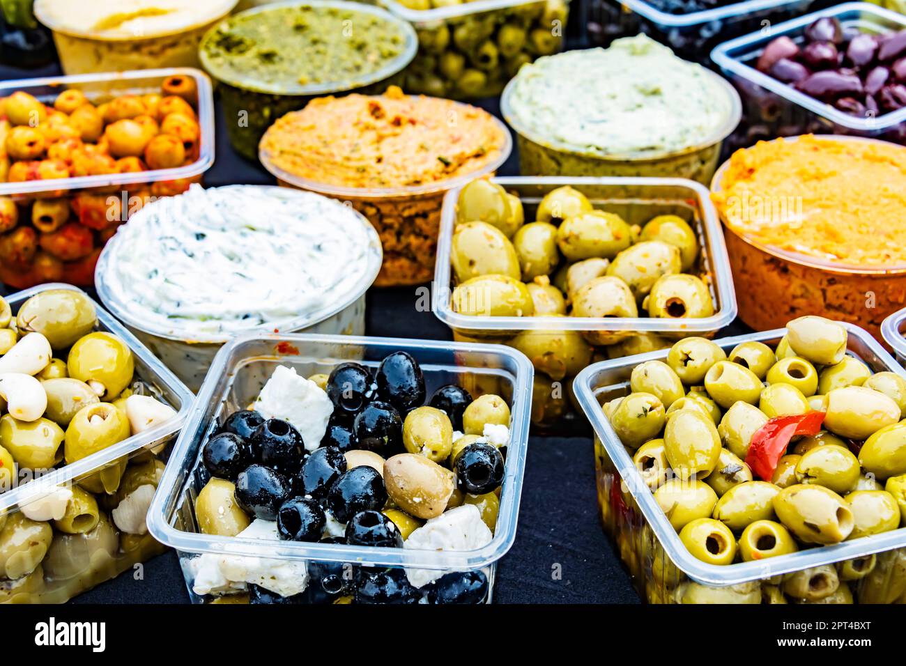 Olives in plastic boxes put up for sale in the store Stock Photo - Alamy