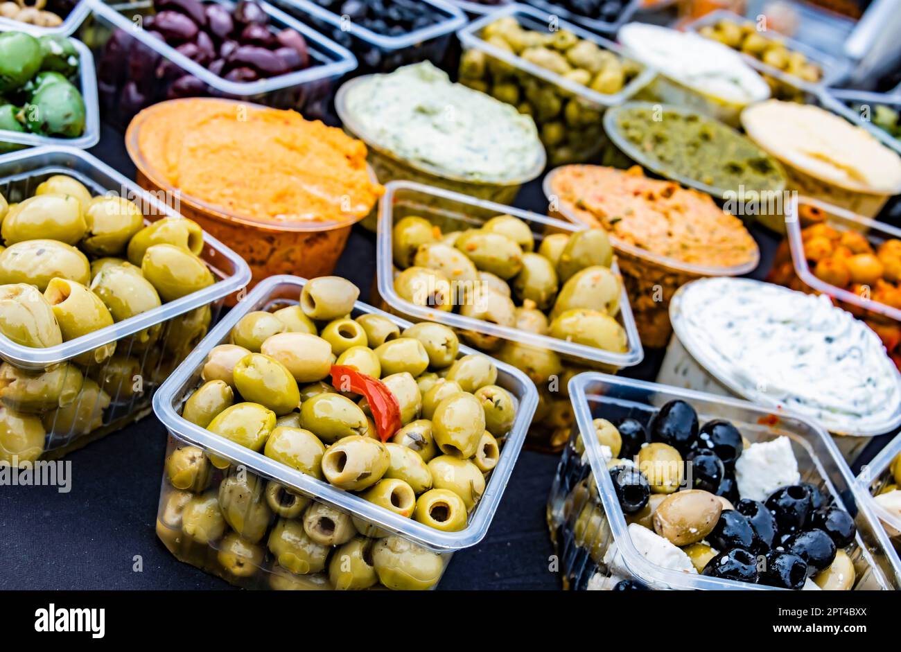Olives in plastic boxes put up for sale in the store Stock Photo - Alamy