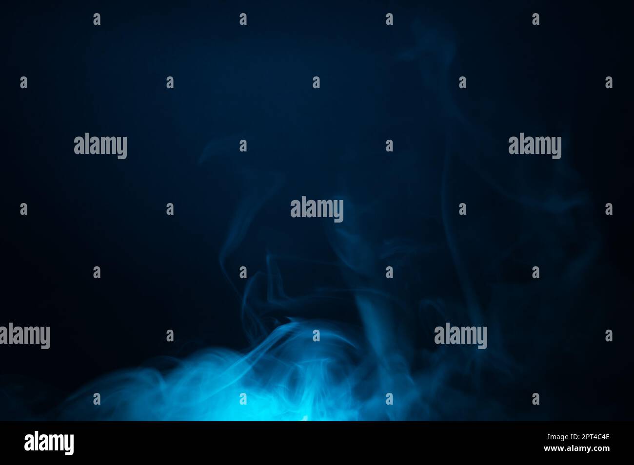 Blue smoke clouds in the dark abstract background. fog floating in air ...