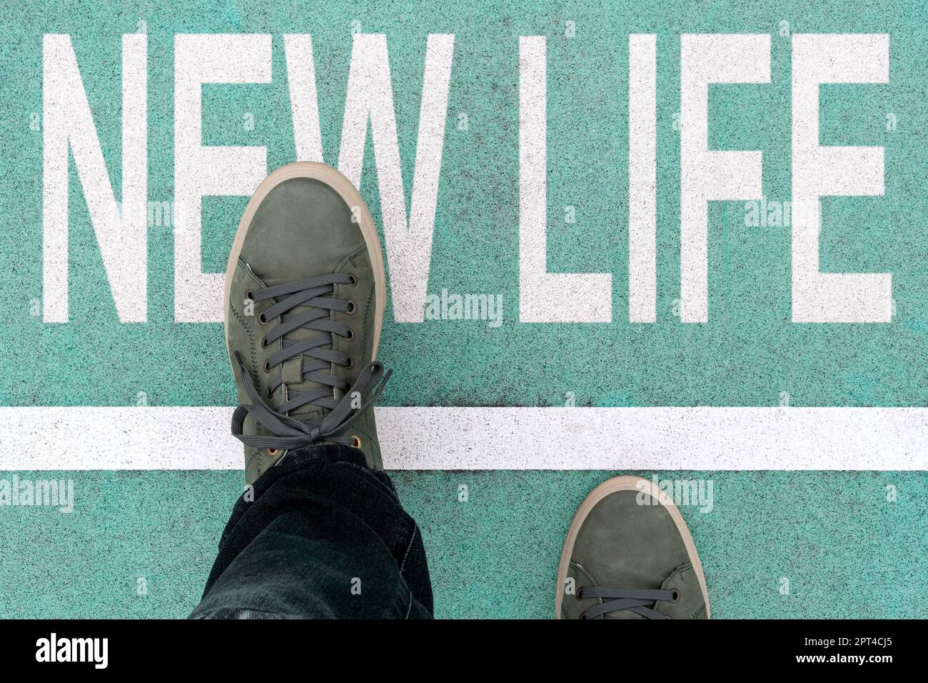 Man crossing the line, starting New Life. Walking across the start line ...