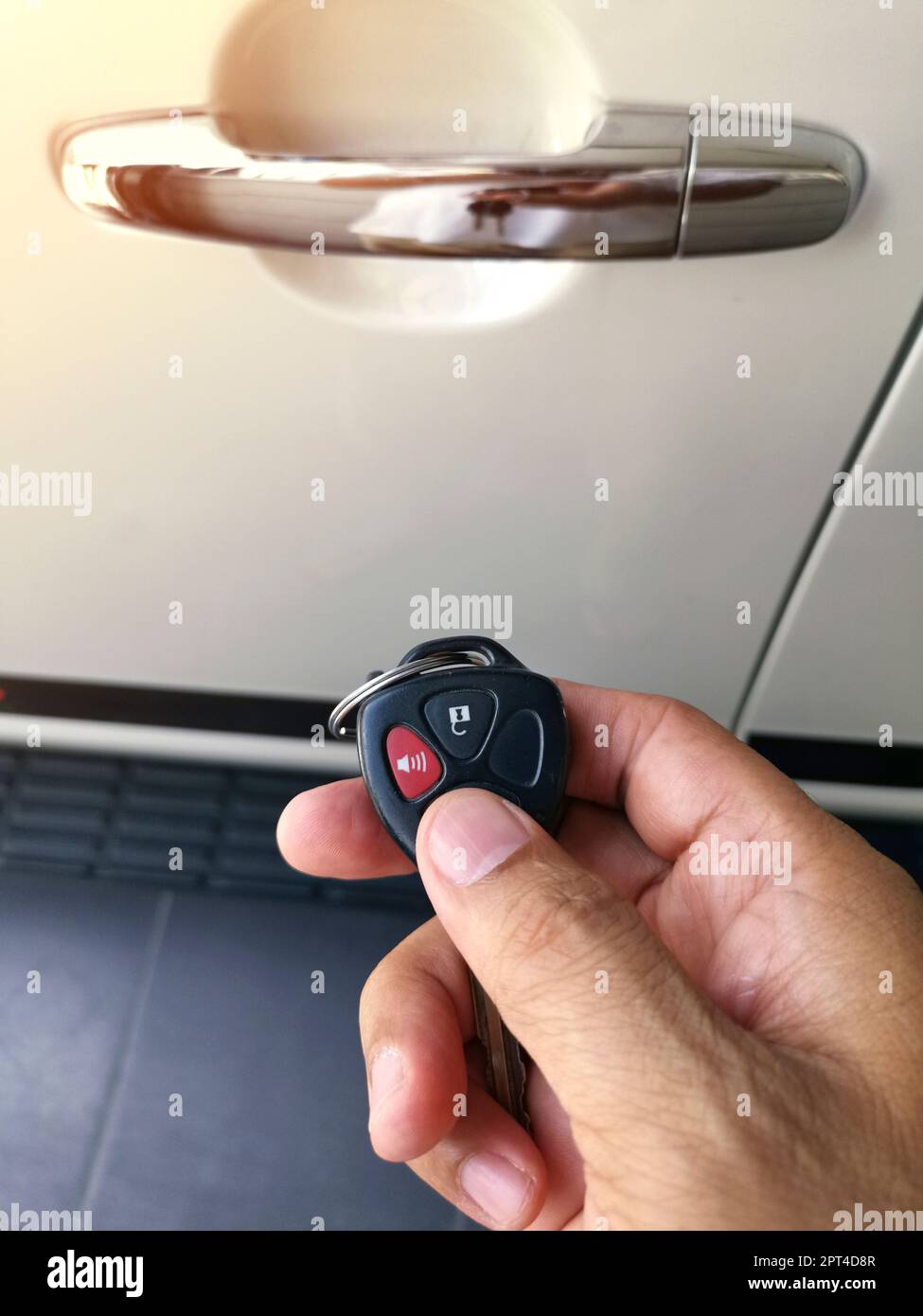 Men's hand presses on the remote control car alarm systems Stock Photo ...