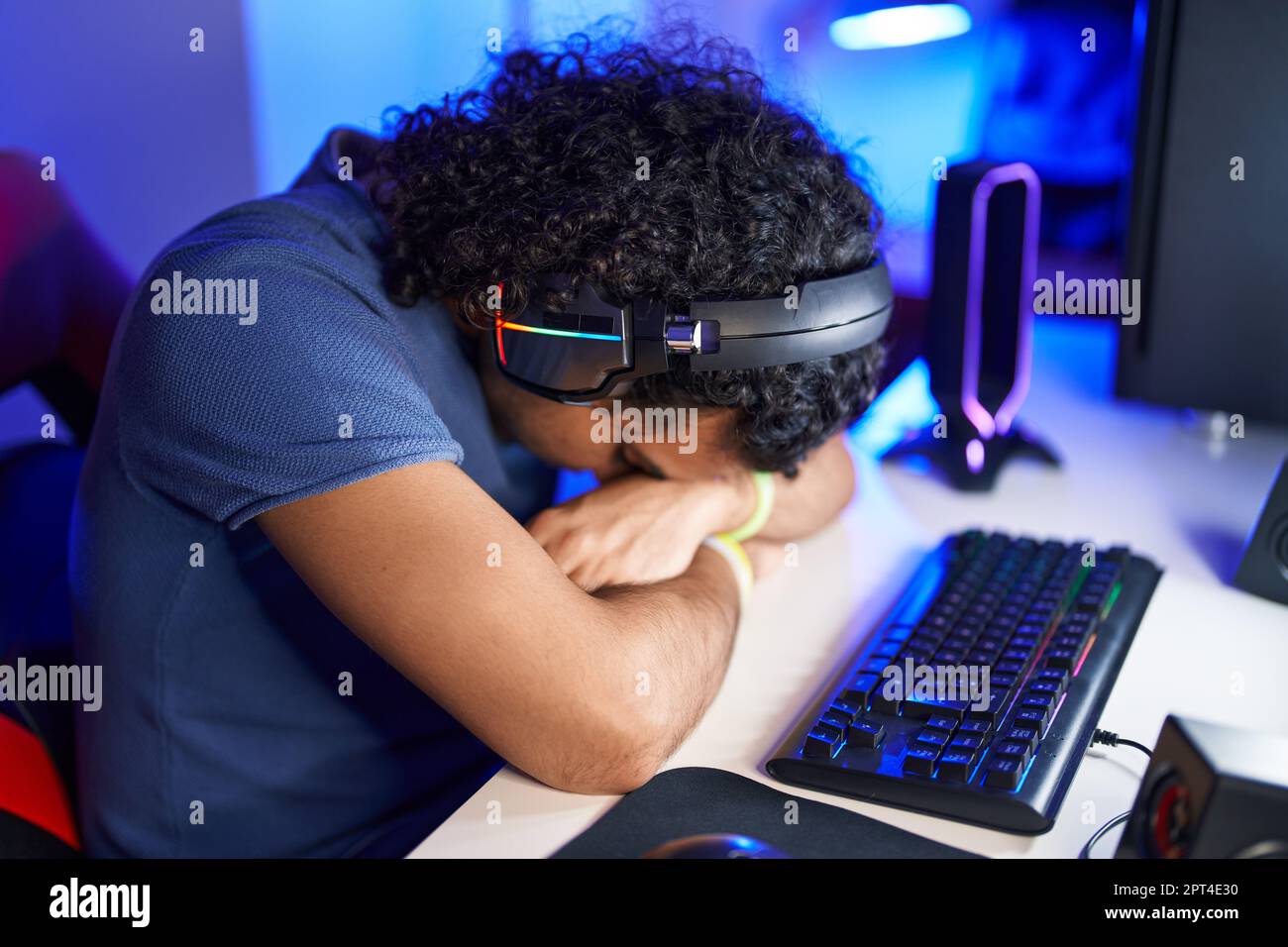 Young latin man streamer stressed using computer at gaming room Stock ...