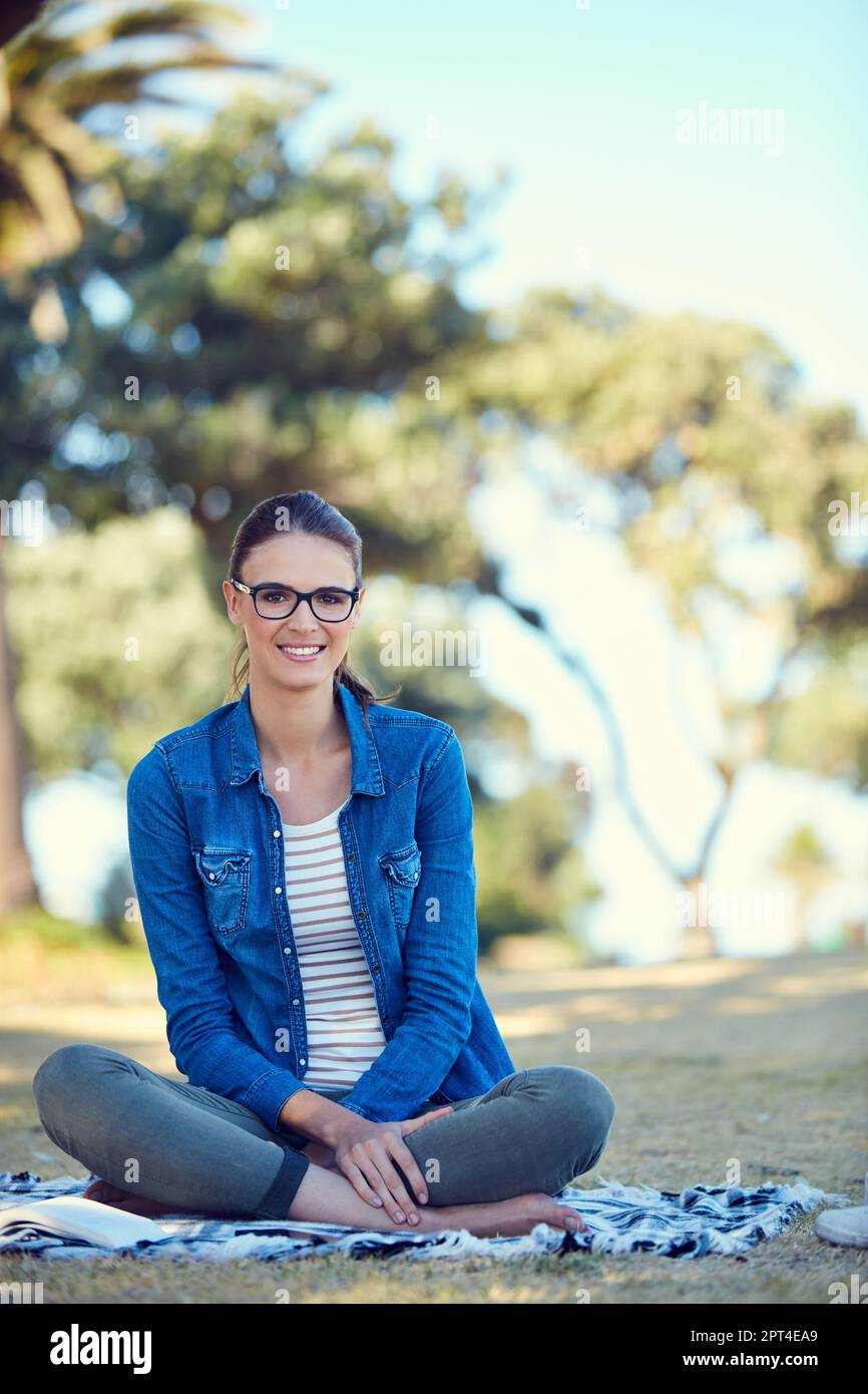 The park is my happy place. Portrait of an attractive young woman ...