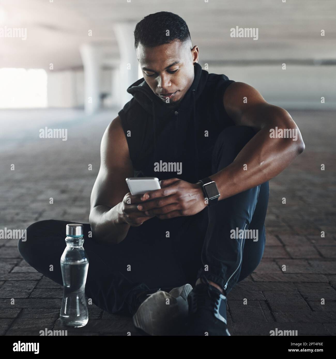 Im just finishing up. Full length shot of a handsome young man sending ...