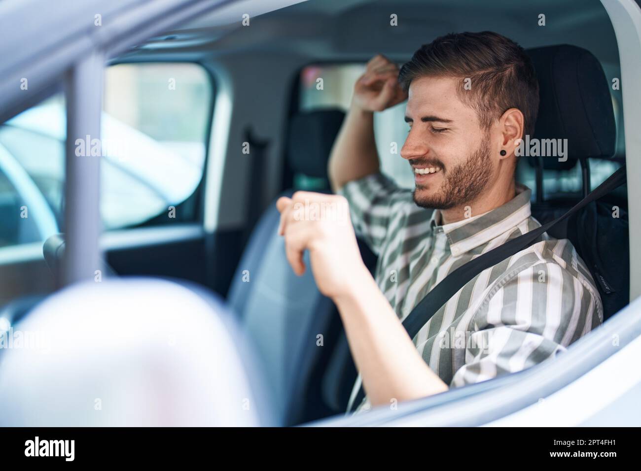 Man driving car dancing listening hi-res stock photography and images ...