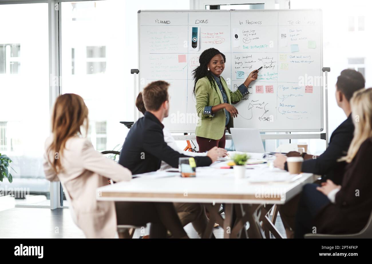 Making great progress through teamwork. a businesswoman giving a ...