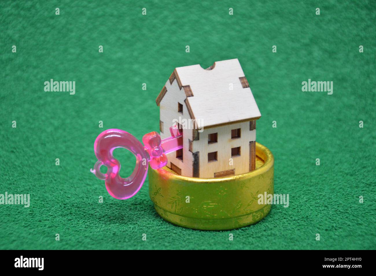 Receiving keys to his apartment building on a background a of green ...