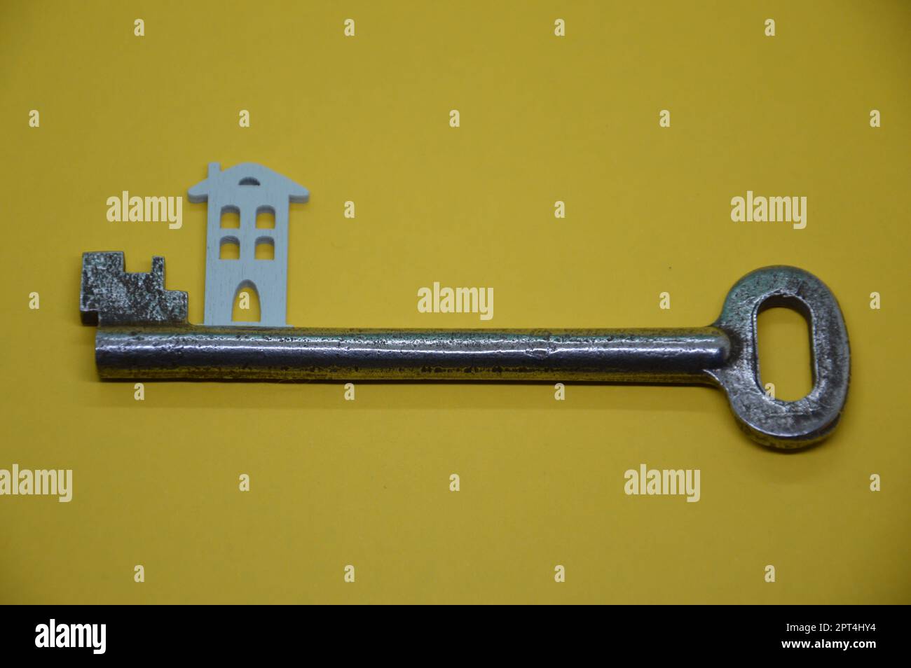 Receiving keys to your apartment building on a the yellow background ...