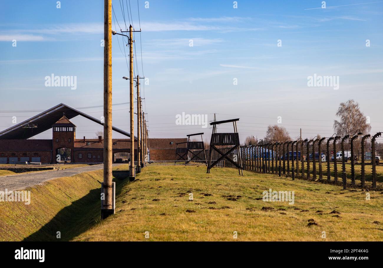 A picture of the fences, watchtowers and main gate of Auschwitz II ...