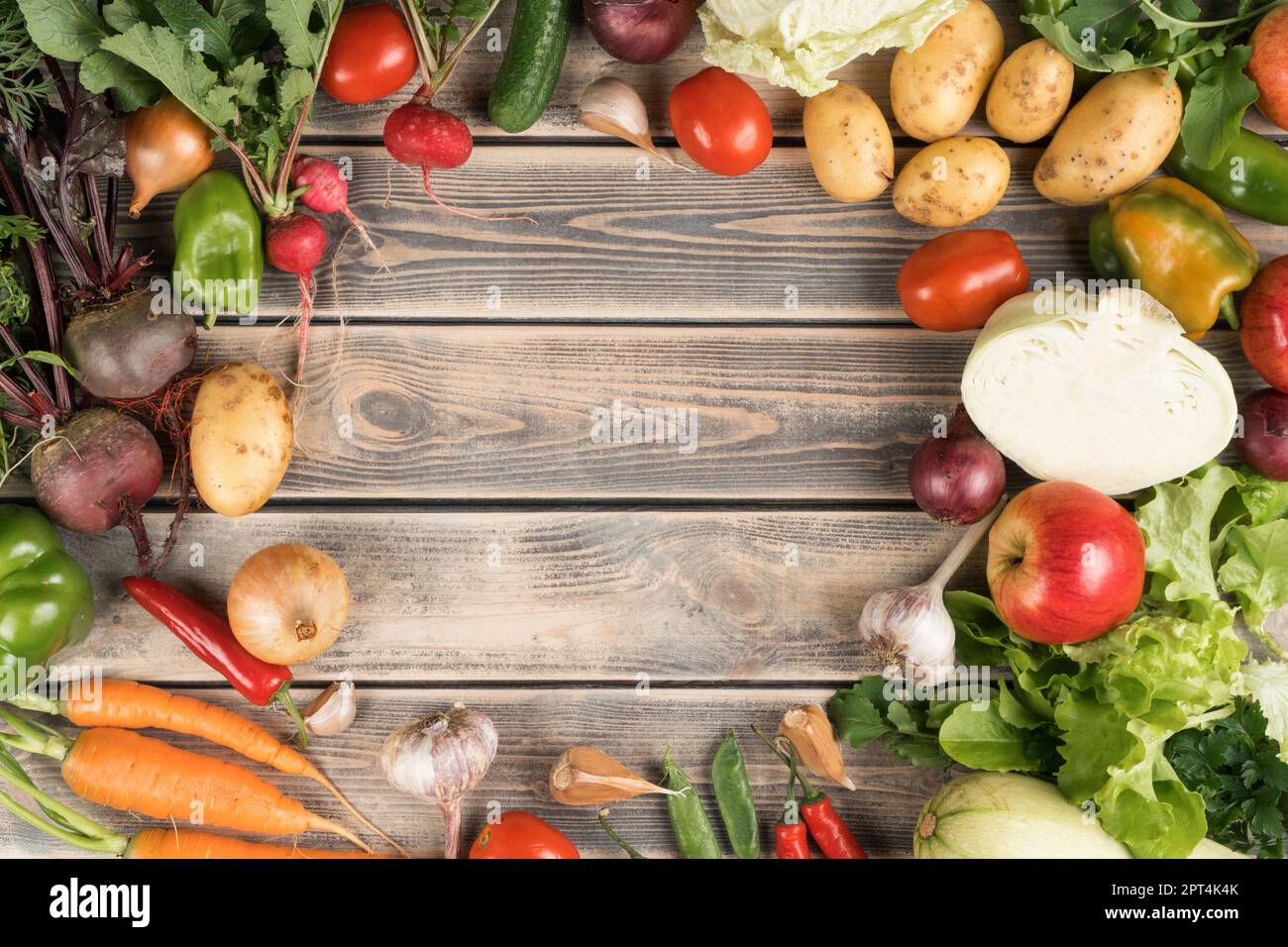 Colorful mix of fresh farm vegetables and fruits, top view. Table full ...
