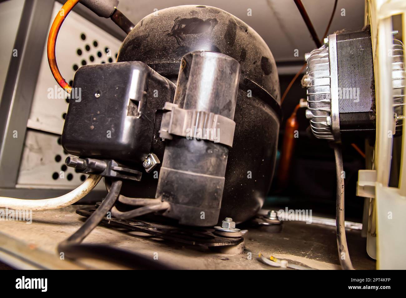 Repair of the engine of an industrial refrigerator unit. Refrigerator ...