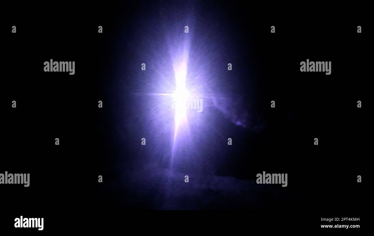 Bright flash of light on black the background Stock Photo - Alamy