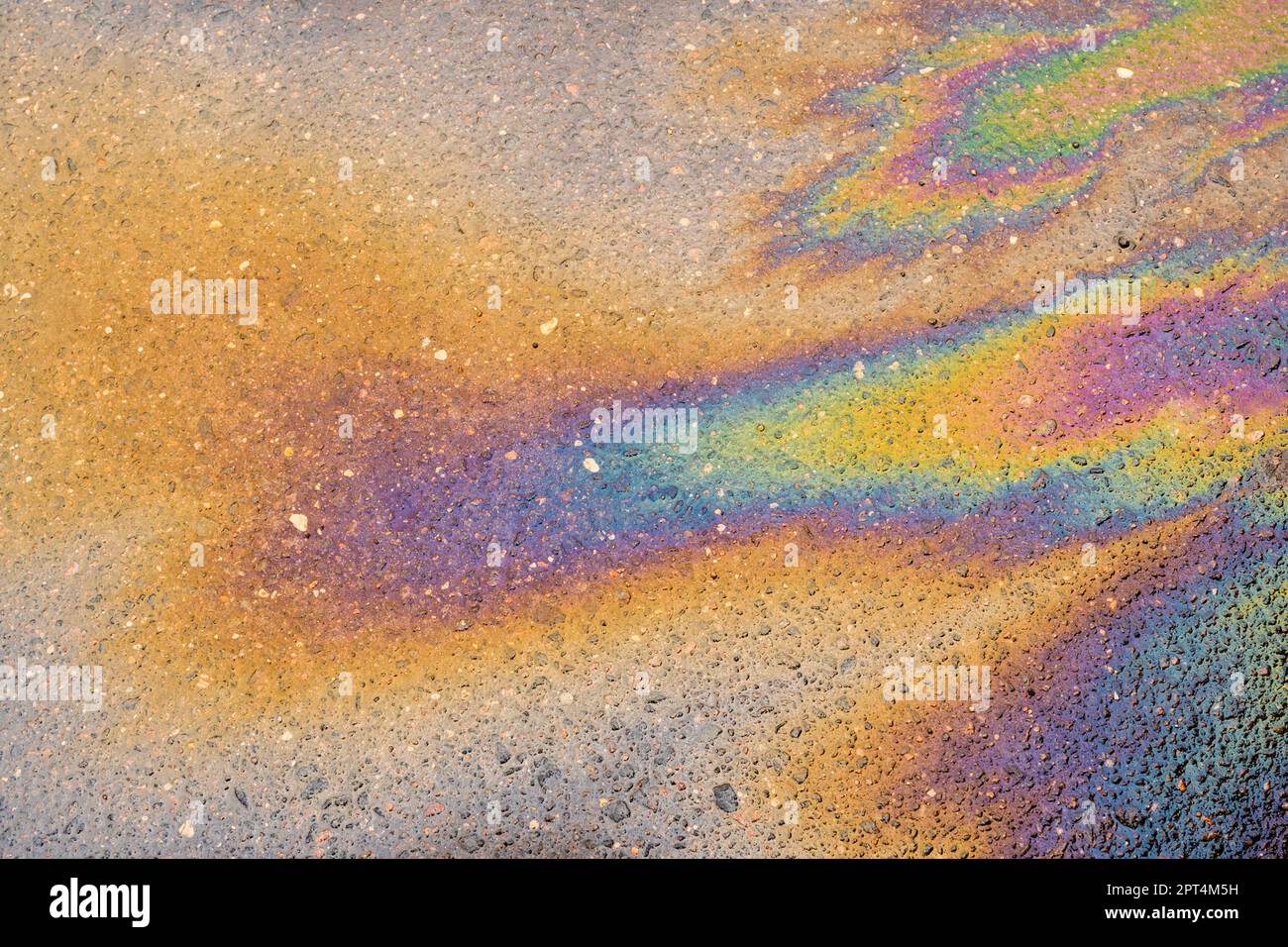 Spilled oil on the asphalt road background Stock Photo - Alamy
