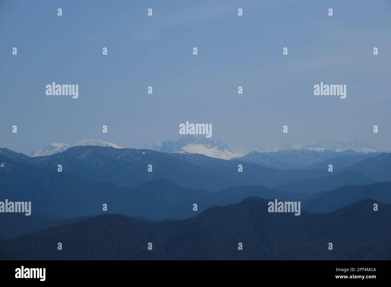View of snowy peak of Mount Fisht from afar. Main Caucasian ridge in ...