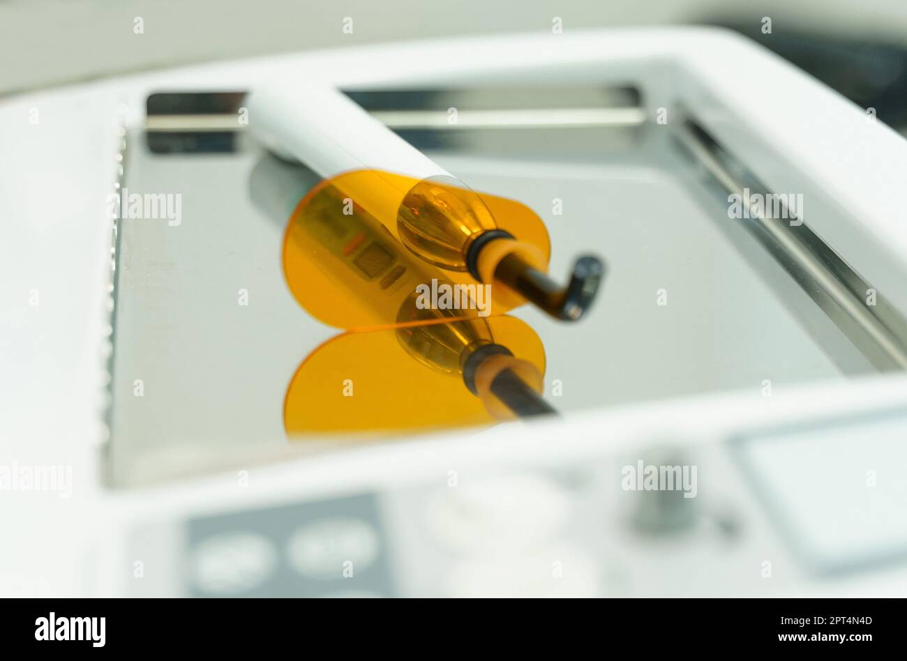 On the mirror surface lies a device for filling and drying teeth - a ...