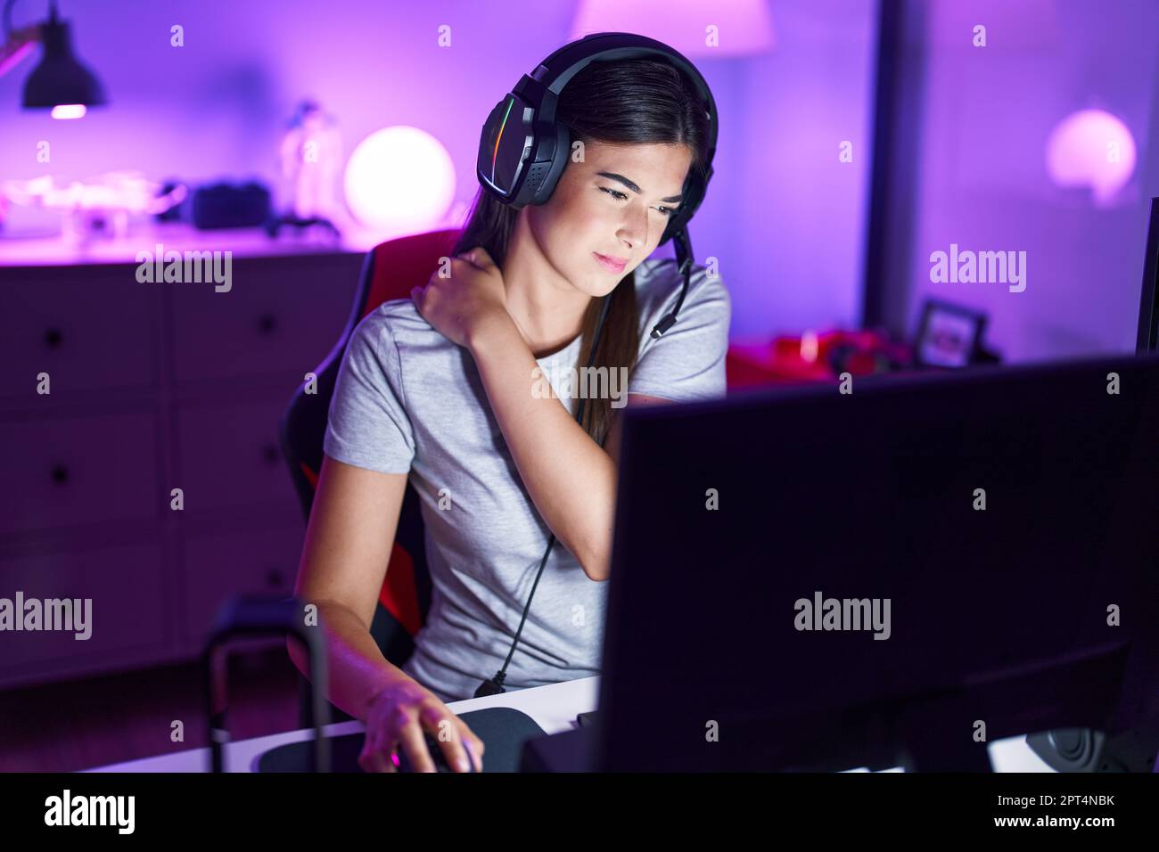 Young beautiful hispanic woman streamer stressed using computer at ...