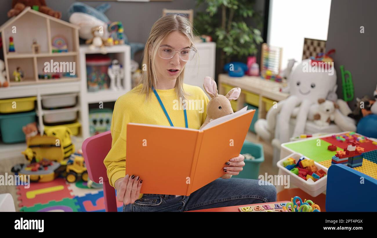 Teacher reading out loud to classroom hi-res stock photography and ...
