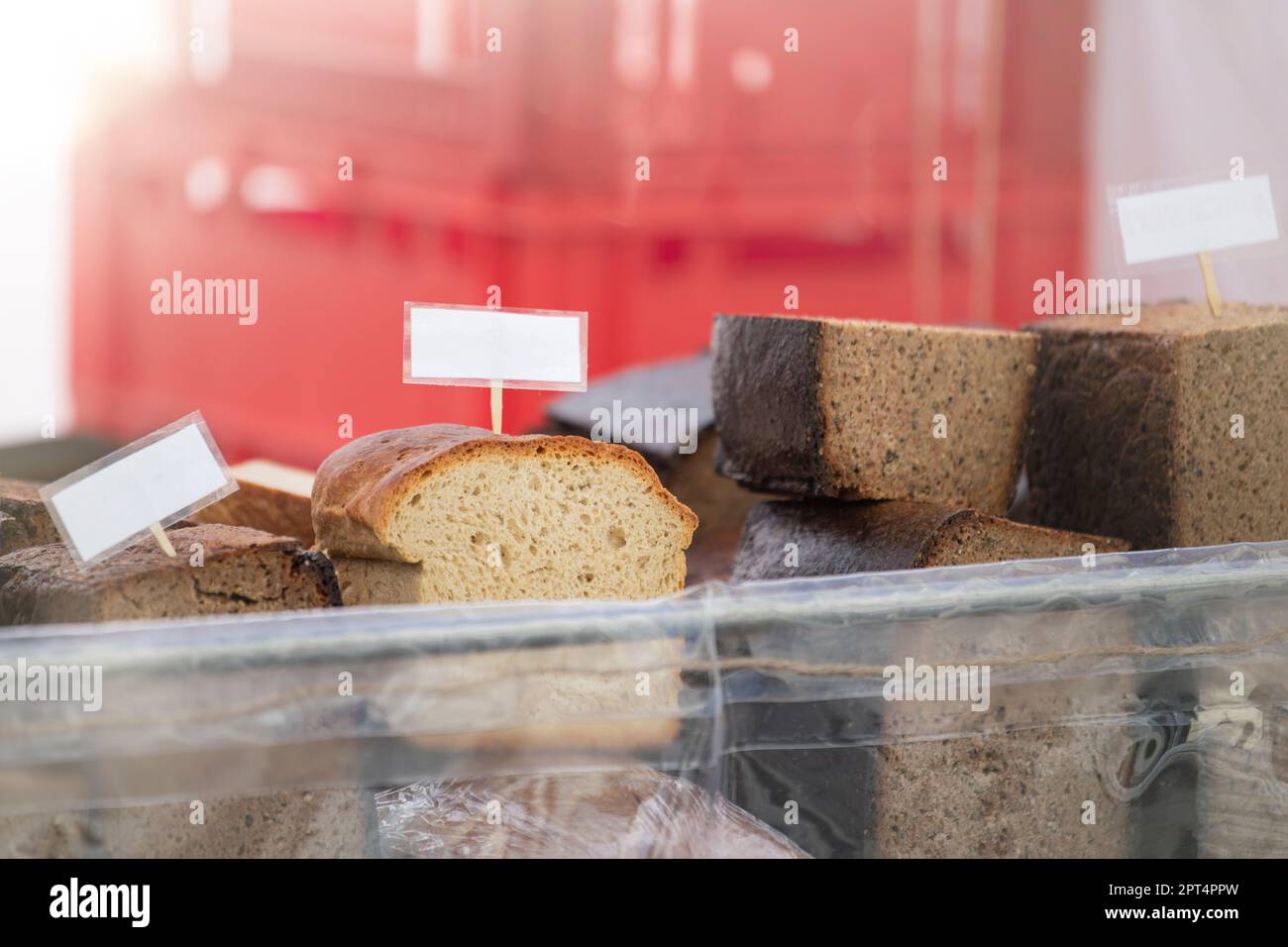 Buy bread at the store. Black and white bread on the bakery counter ...