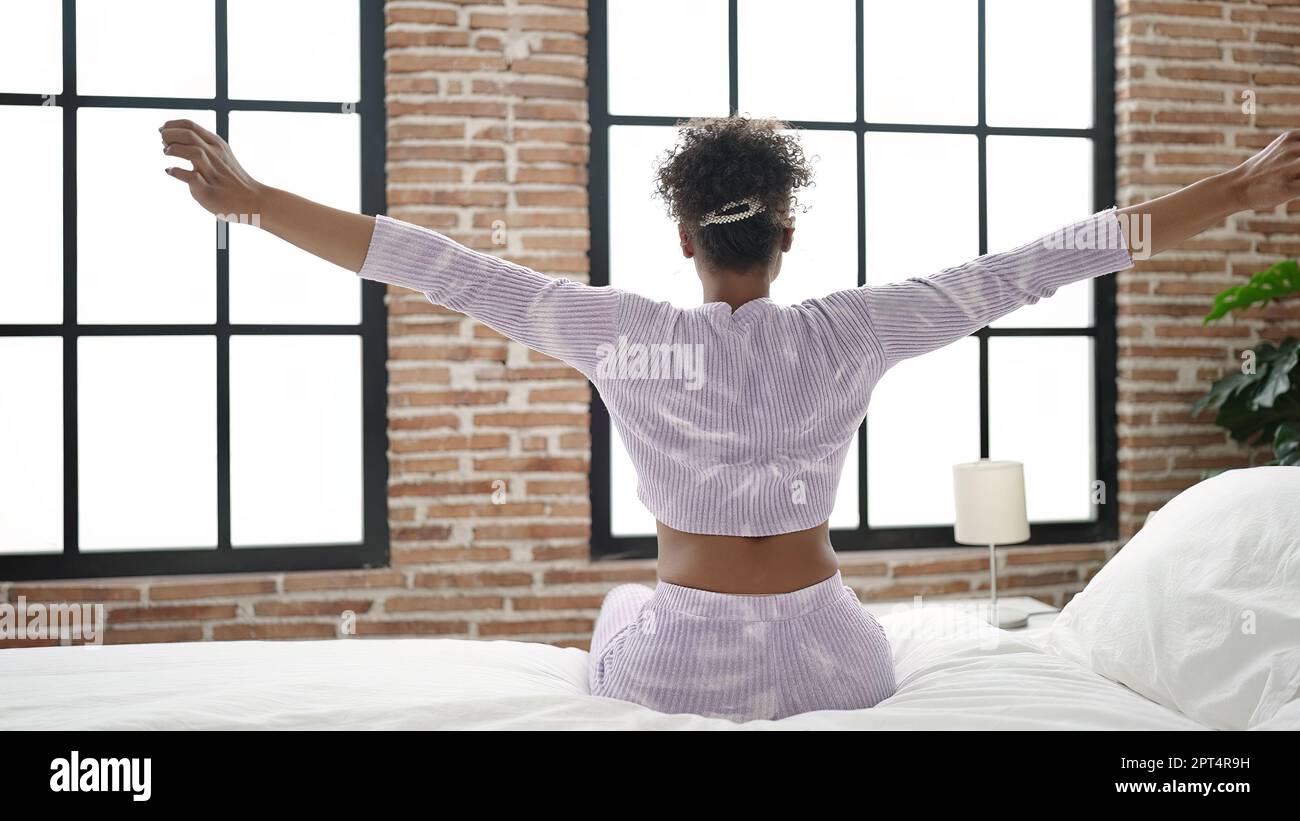 African american woman waking up stretching arms hi-res stock ...