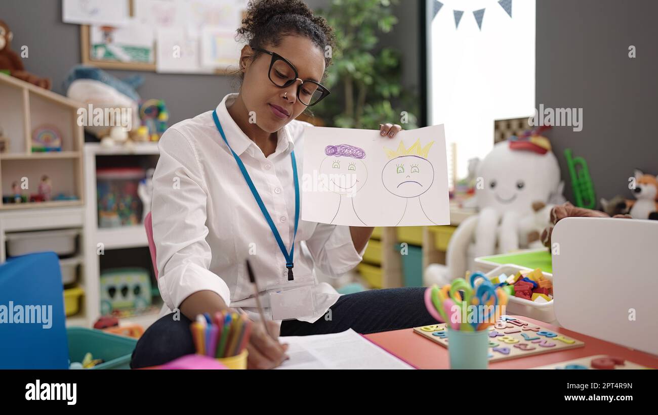 African american woman teacher having emotion therapy writing on ...