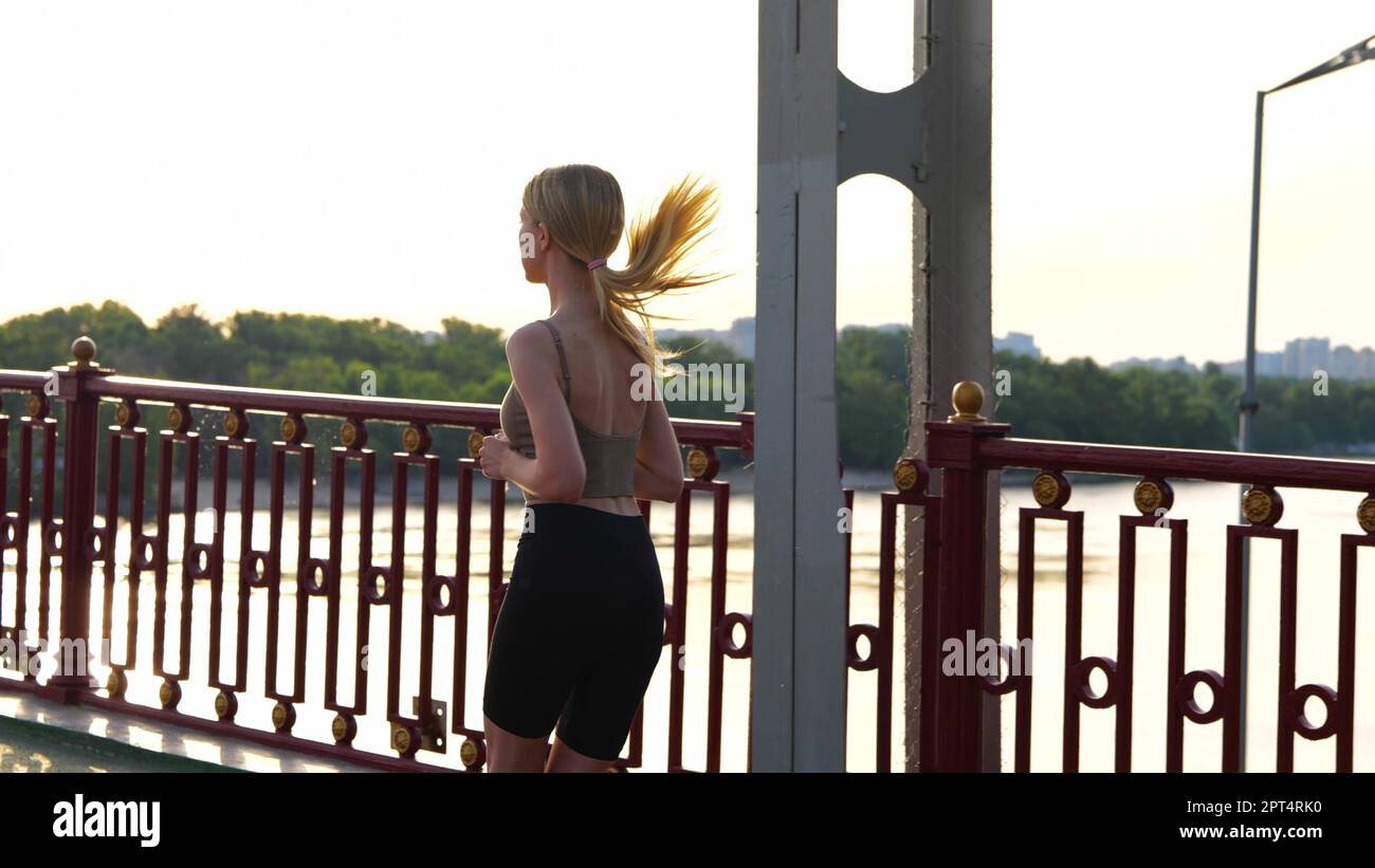 Female runner in slow motion hi-res stock photography and images - Alamy