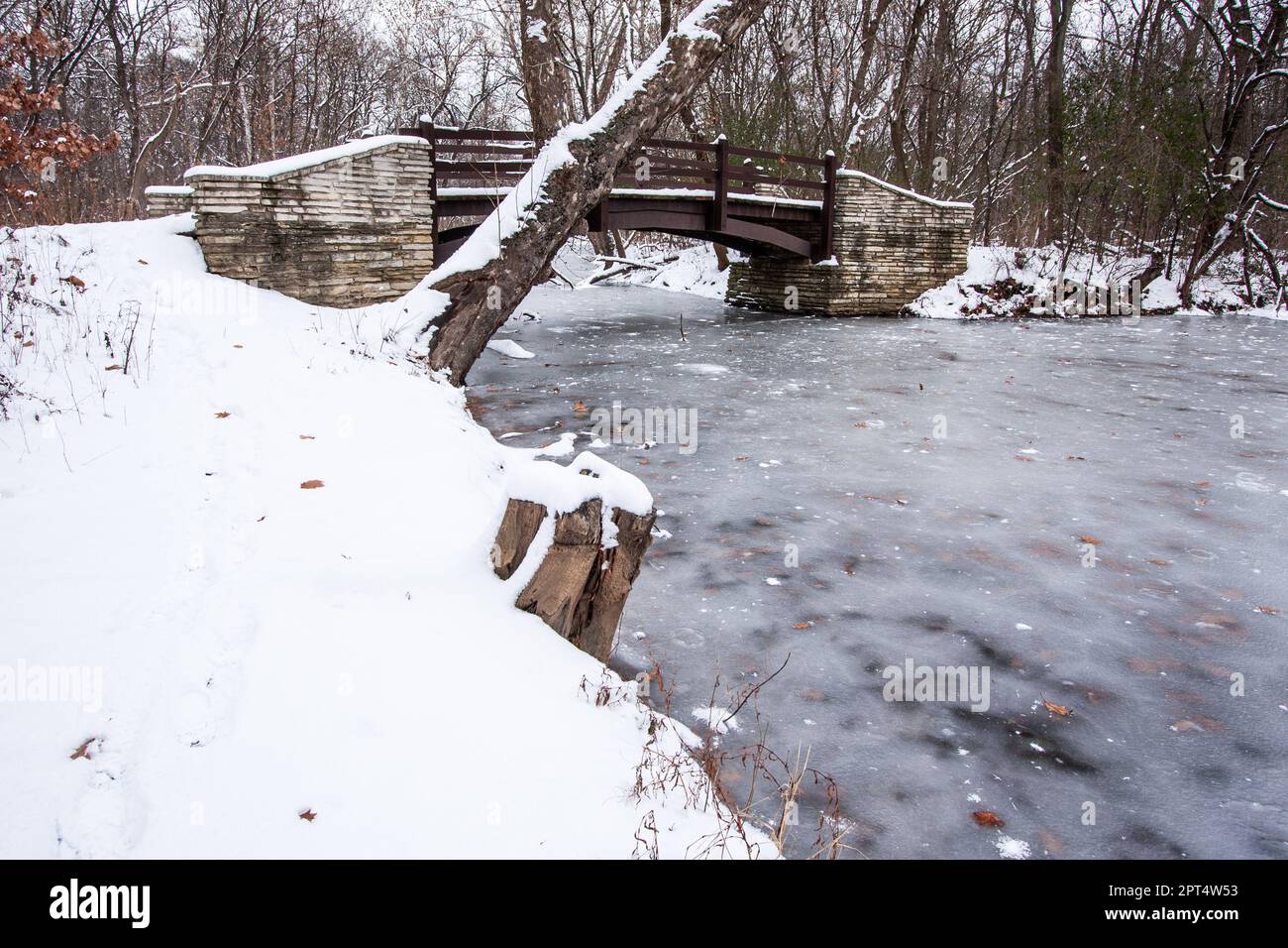 Rustic Bridge Over Frozen River In Winter Stock Photo - Alamy