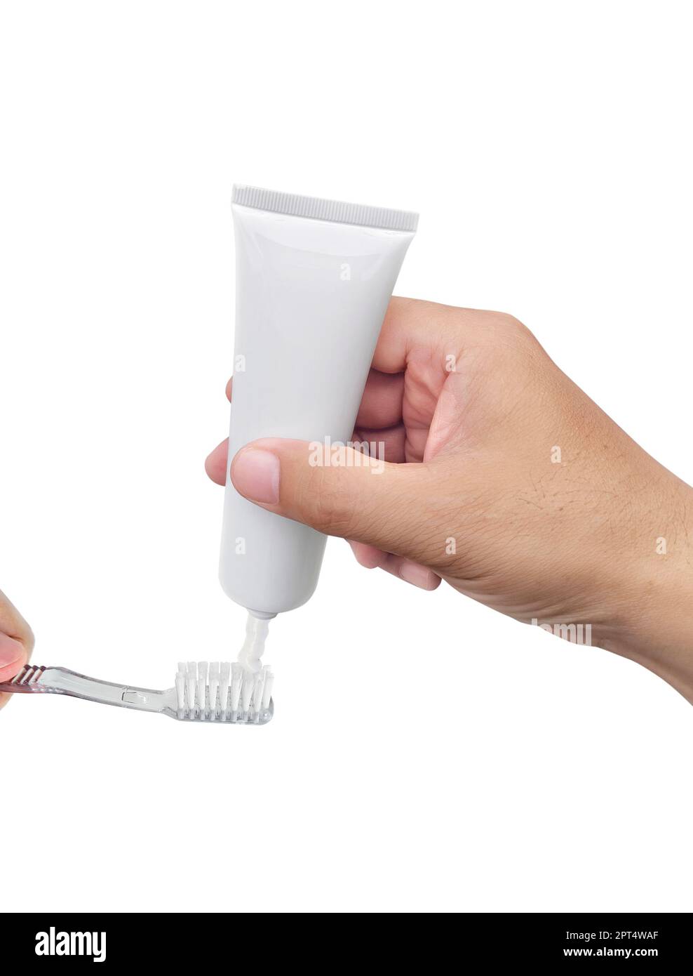 The guy squeezes toothpaste on the toothbrush Stock Photo - Alamy