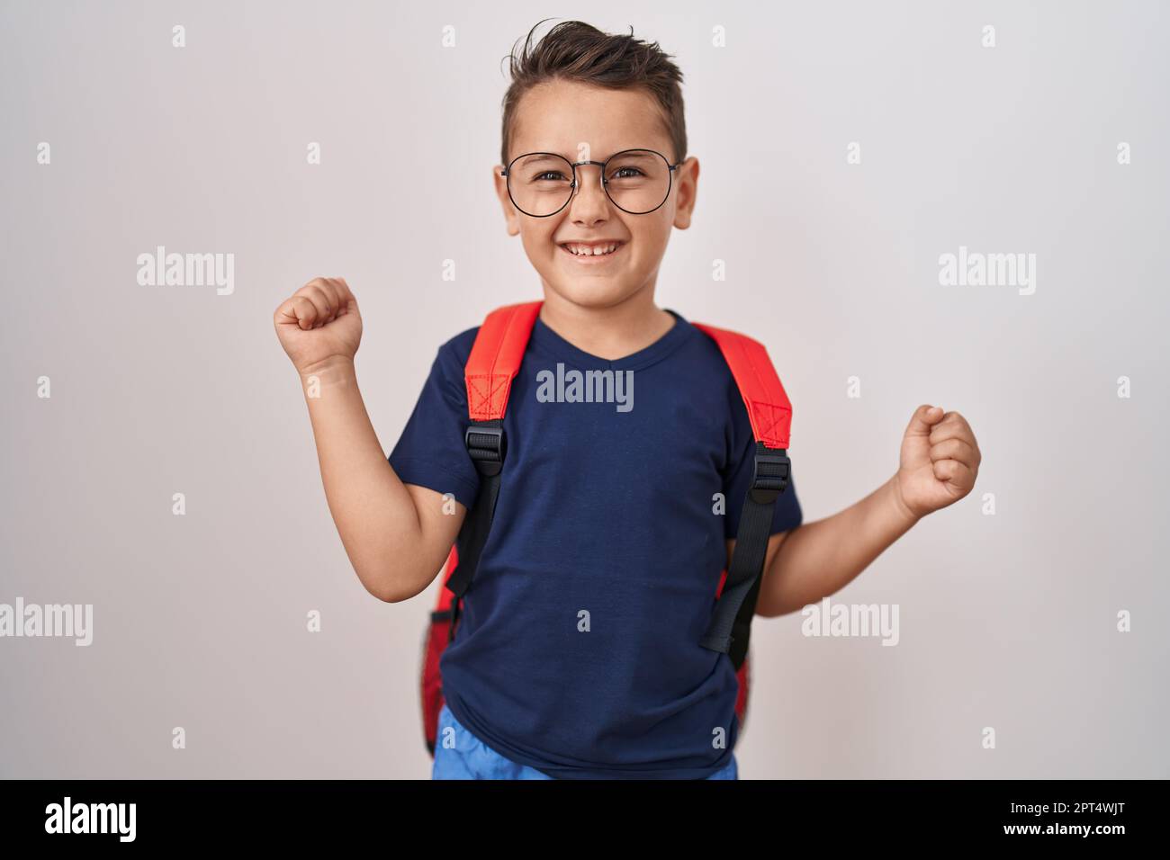 Little hispanic boy wearing glasses and student backpack screaming ...