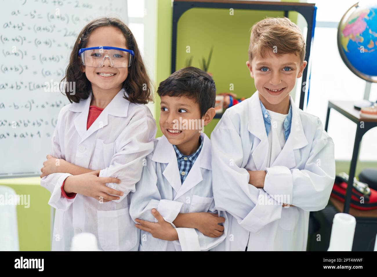 Group of kids scientists students smiling confident standing with arms ...