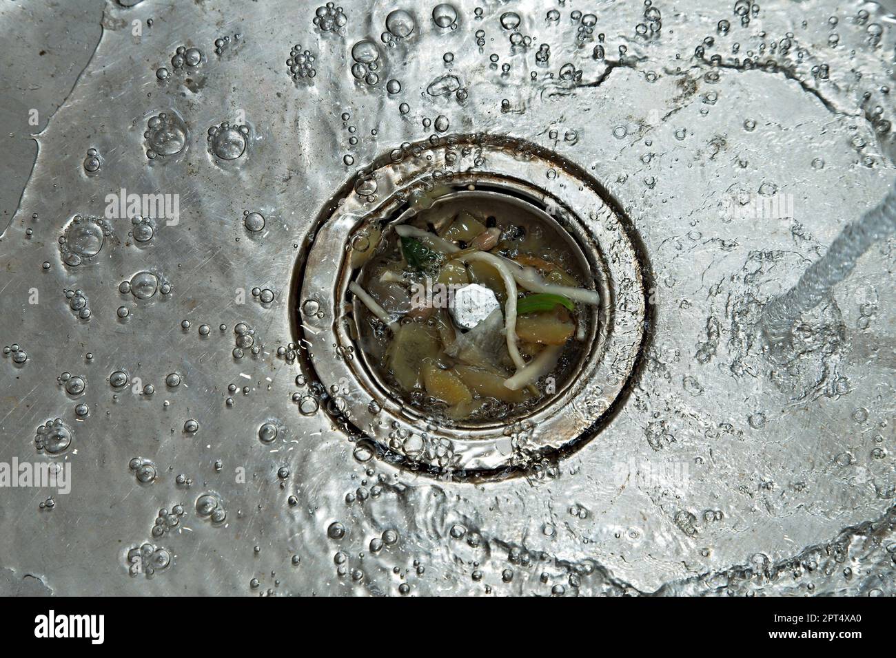Kitchen drain clogging up with food particles Stock Photo - Alamy