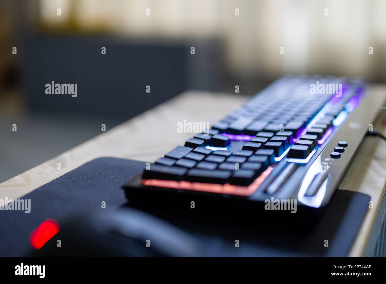 Cyber sport gamer play game with RGB keyboard Stock Photo - Alamy