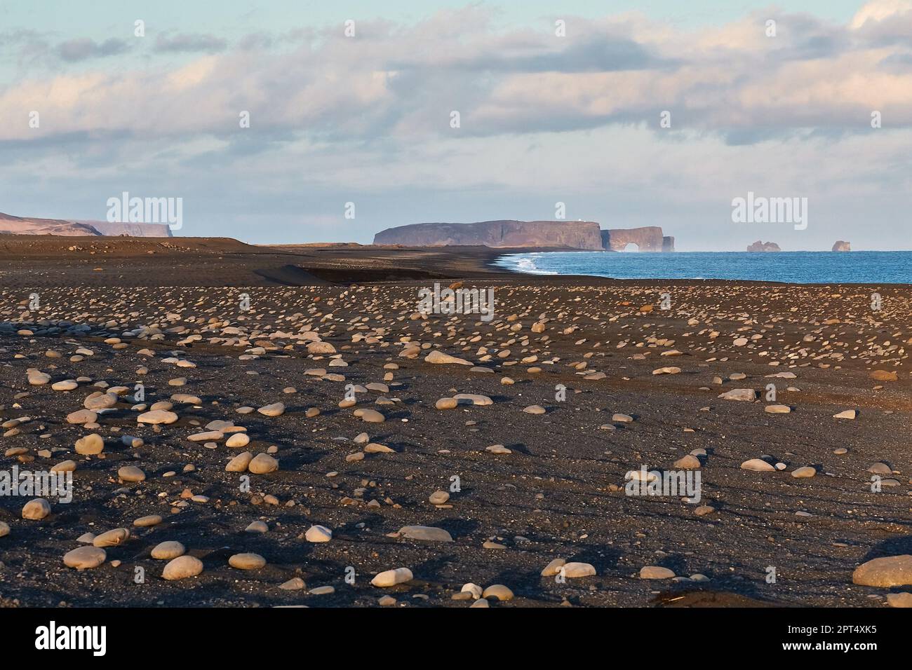 Cliffs of Dyrholaey at the sea shore in Iceland, sunset sky Stock Photo ...