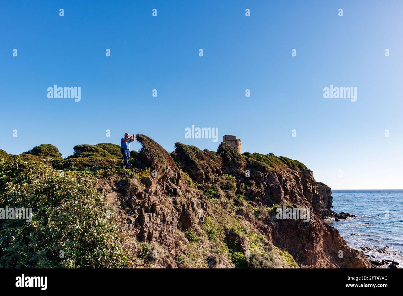 Man taking a photo just before falling off a cliff Stock Photo - Alamy