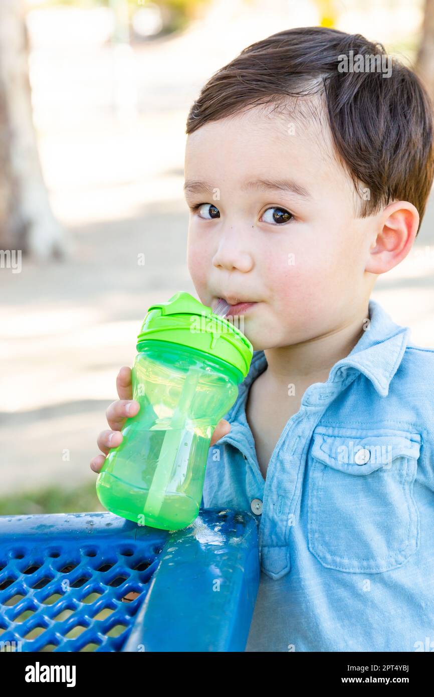 Asian boy drinking water hi-res stock photography and images - Alamy