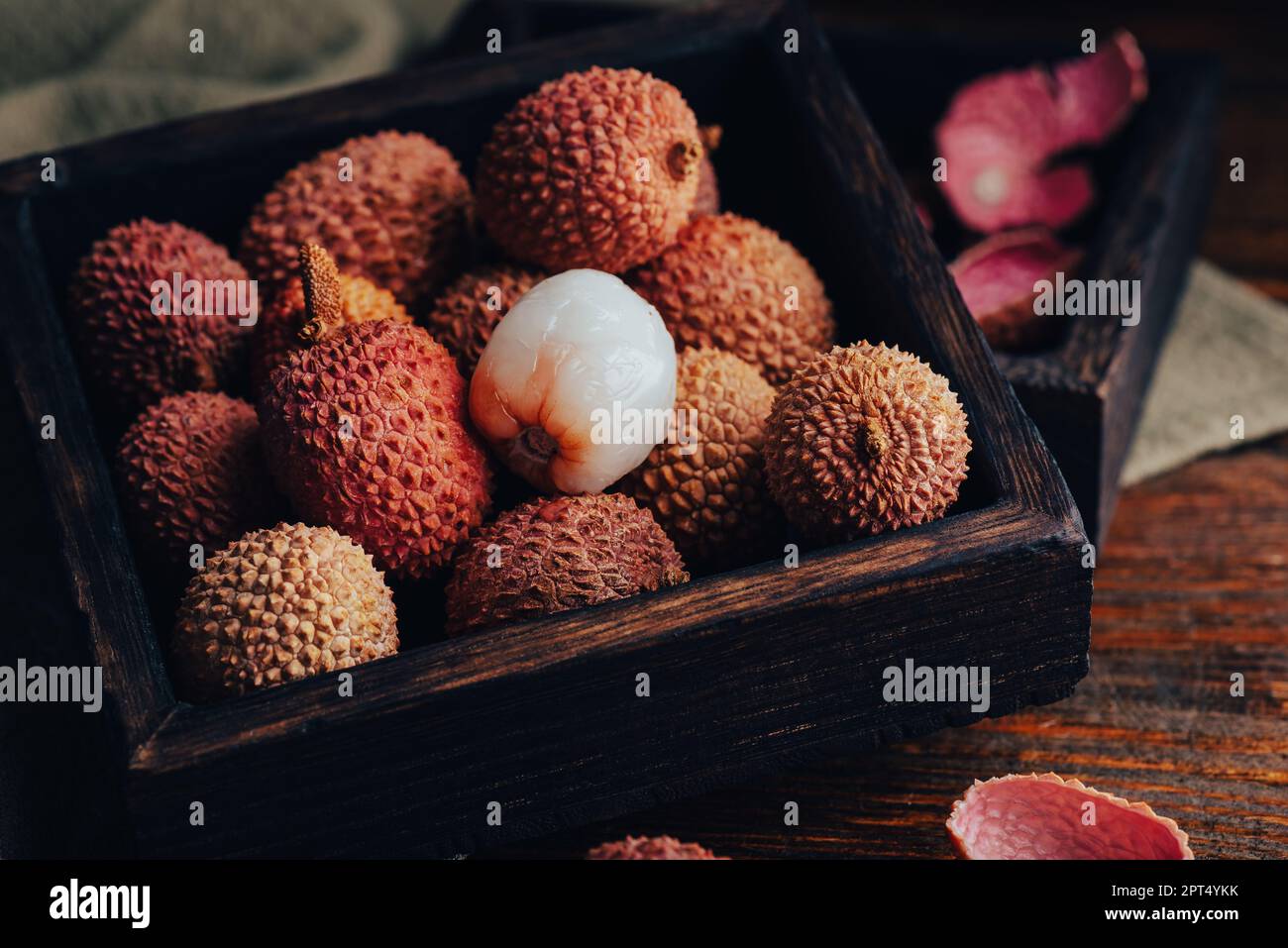 Delicious Fruits of Lychee in Rustic Box Stock Photo - Alamy