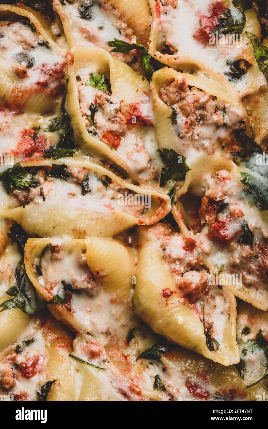 Baked jumbo shells pasta stuffed with ground beef, spinach and cheese ...