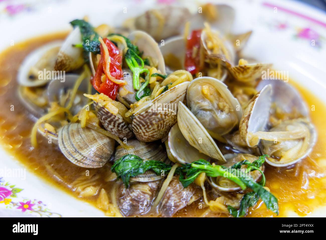 Fry clam with basil in Taiwan style Stock Photo - Alamy