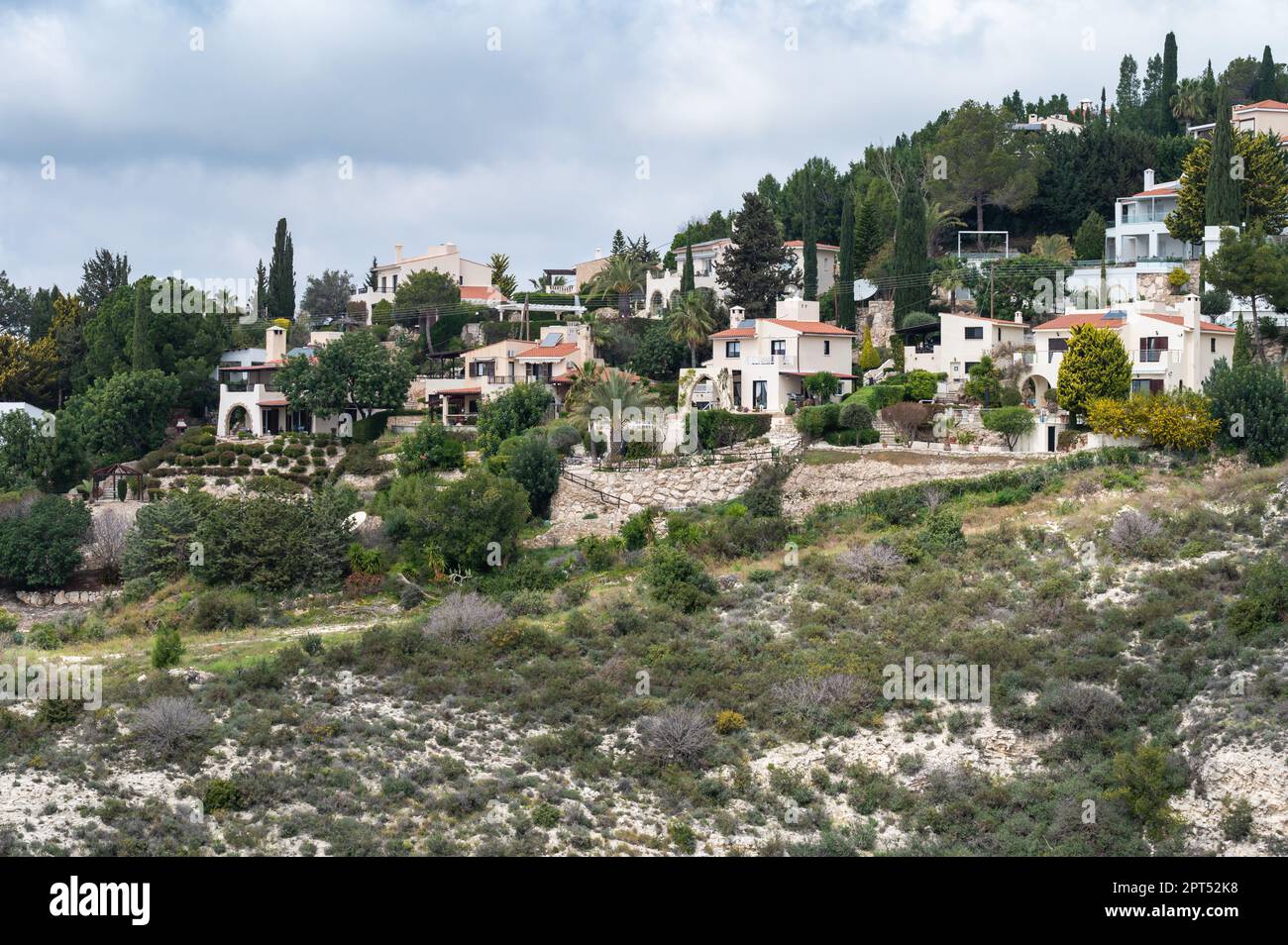 Tala, Cyprus - March 27, 2023 - Green rocky mountains and white houses ...