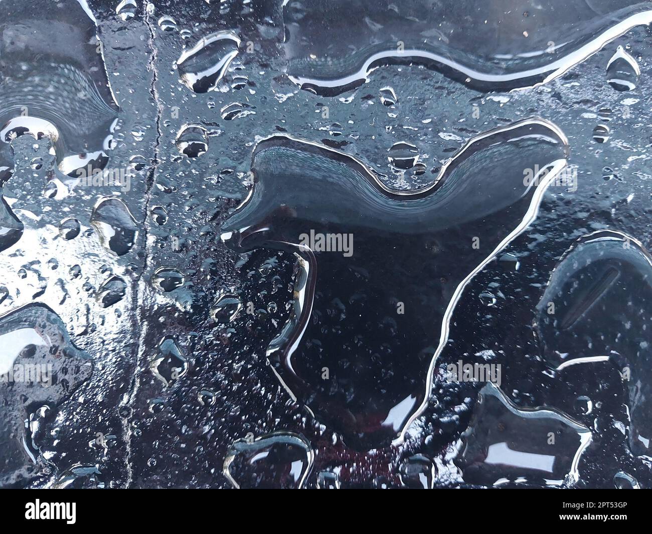 Spraying liquid bituminous mastic on the concrete foundation for the ...