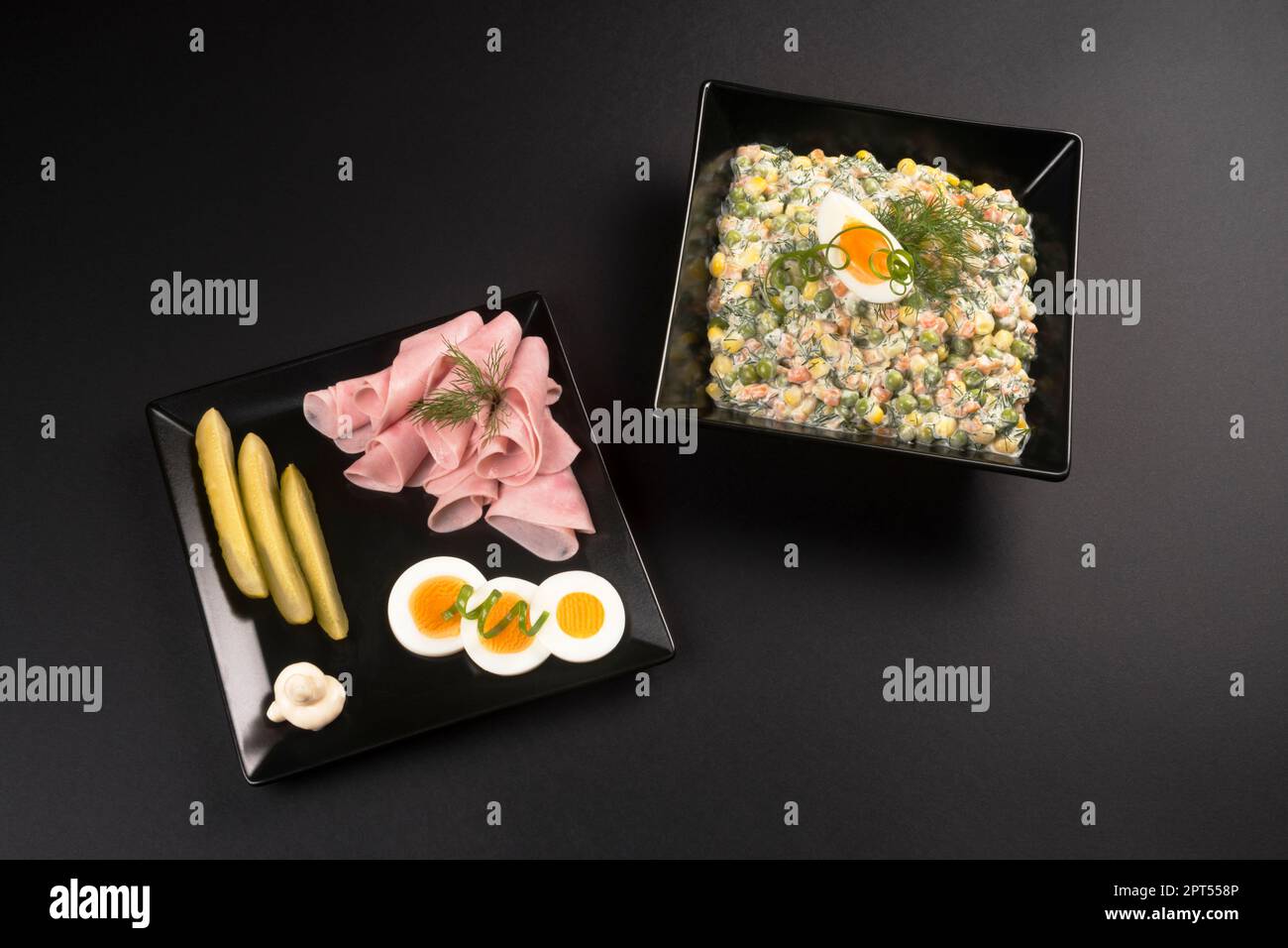 Luxury gourmet cold appetizer on black plates on black background Stock ...