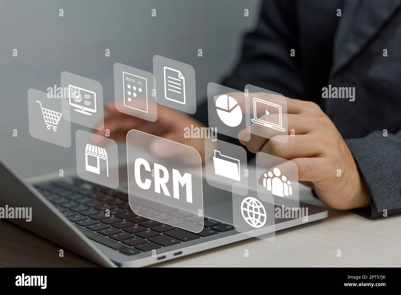 Hand typing on laptop concept. Icons CRM Customer Relationship Management business on virtual ...