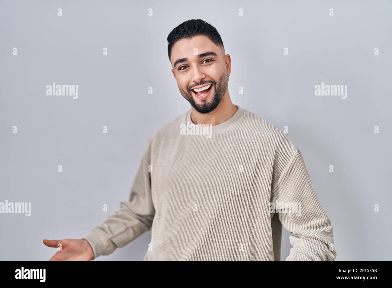 Young handsome man standing over isolated background smiling cheerful ...