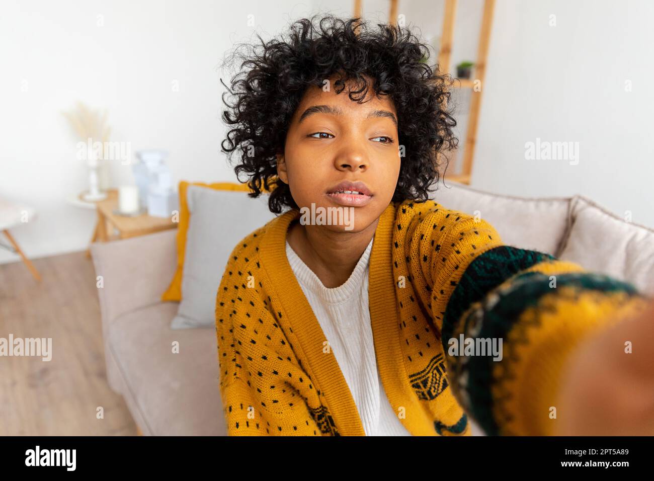 Happy african american teen girl blogger smiling face talking to webcam ...