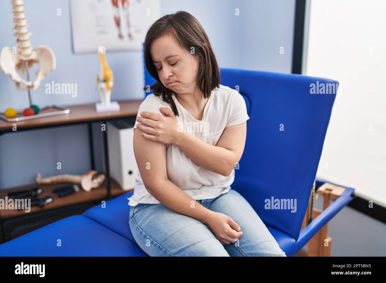 Down syndrome woman physiotherapy patient suffering for arm injury at ...