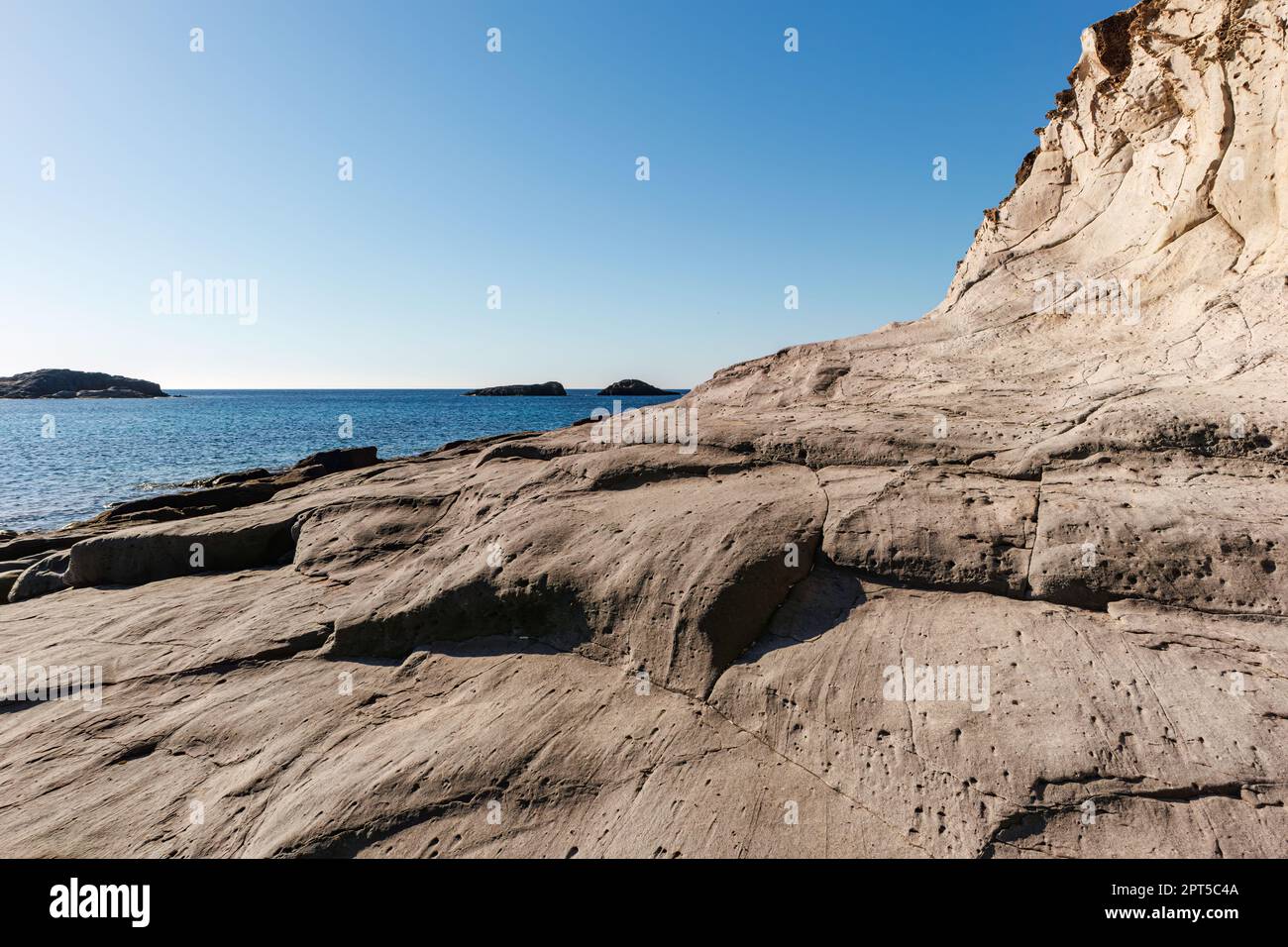 unusual rock formations of the volcanic cliff on Cala Sapone beach ...