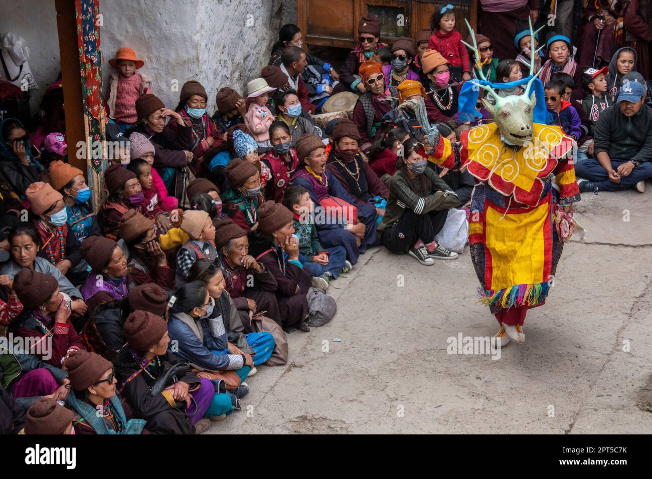 A masked Monk dances in front of the crowd at the Stongdey Monastery ...