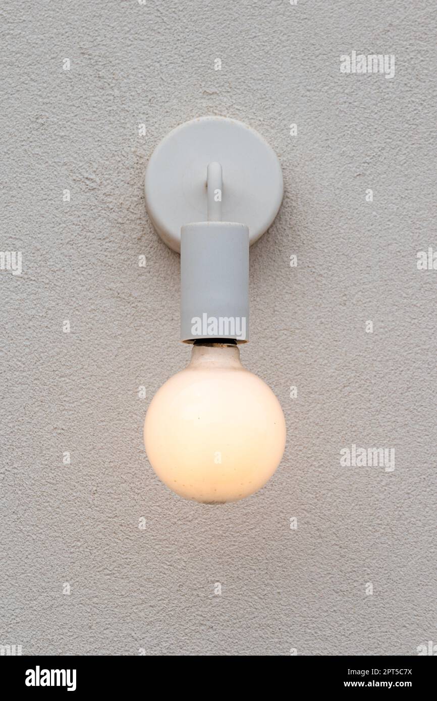 White lamp on a white wall Stock Photo - Alamy