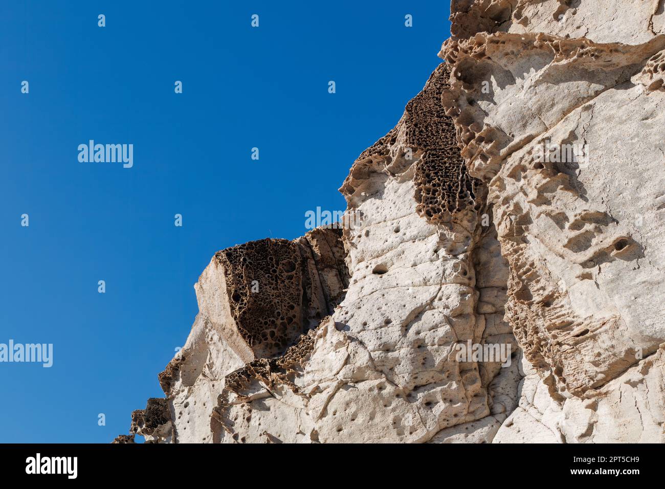 unusual rock formations of the volcanic cliff on Cala Sapone beach ...