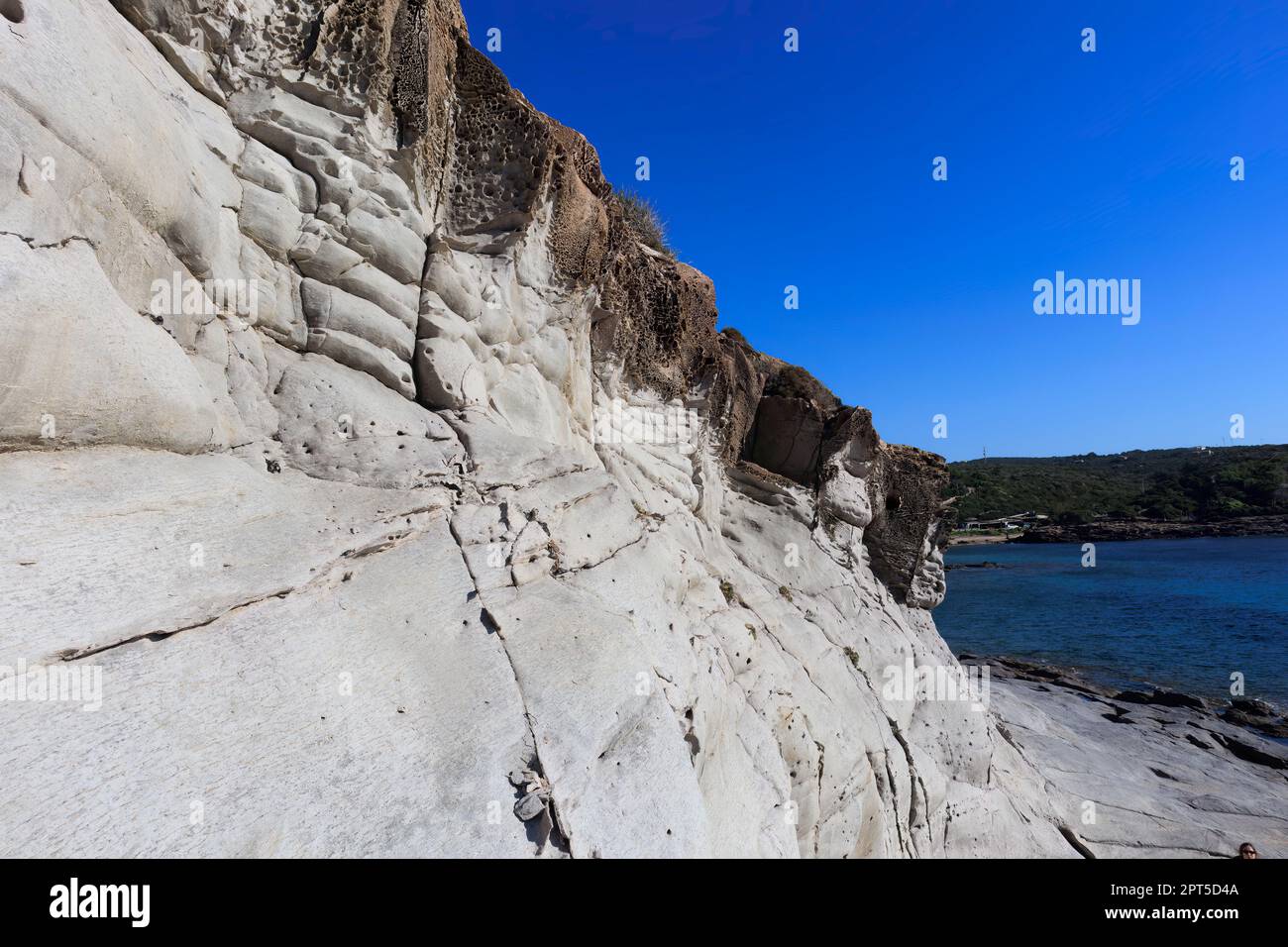 unusual rock formations of the volcanic cliff on Cala Sapone beach ...