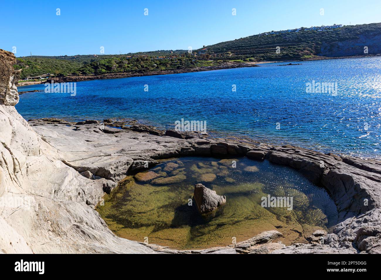 unusual rock formations of the volcanic cliff on Cala Sapone beach ...